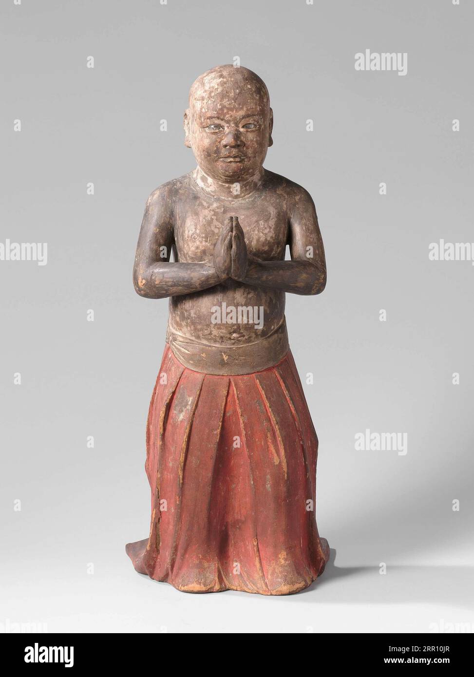 Statue of Shōtoku as a child, with hands pressed together in worship ...