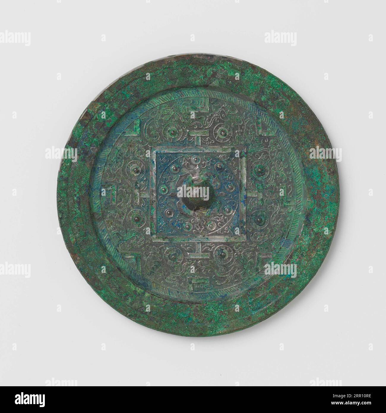 Bronze mirror with geometric patterns and stylized animals, Han dynasty ...