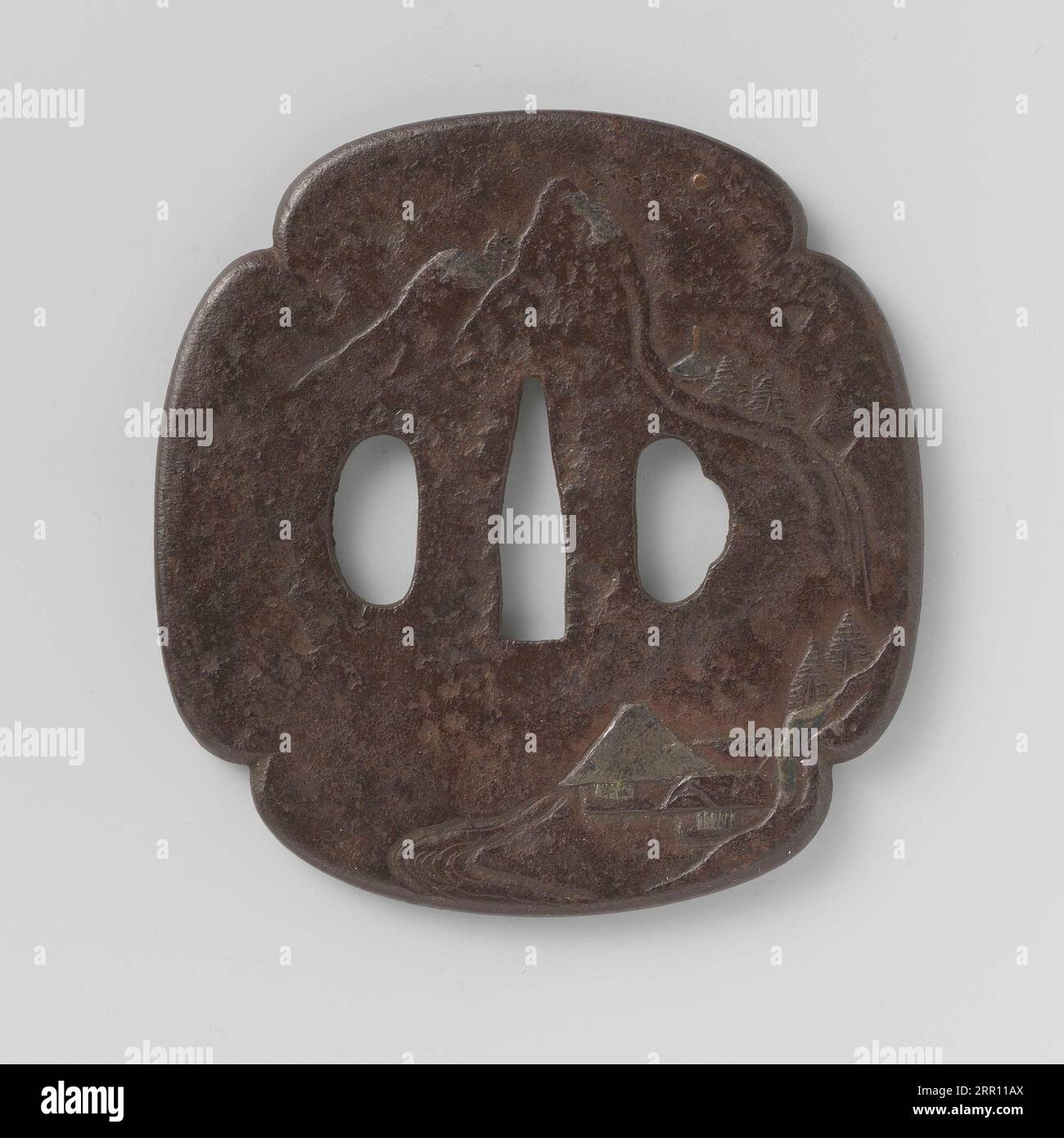 A round oval Iron Tsuba, a sword guard and part of a sword mounting. It ...