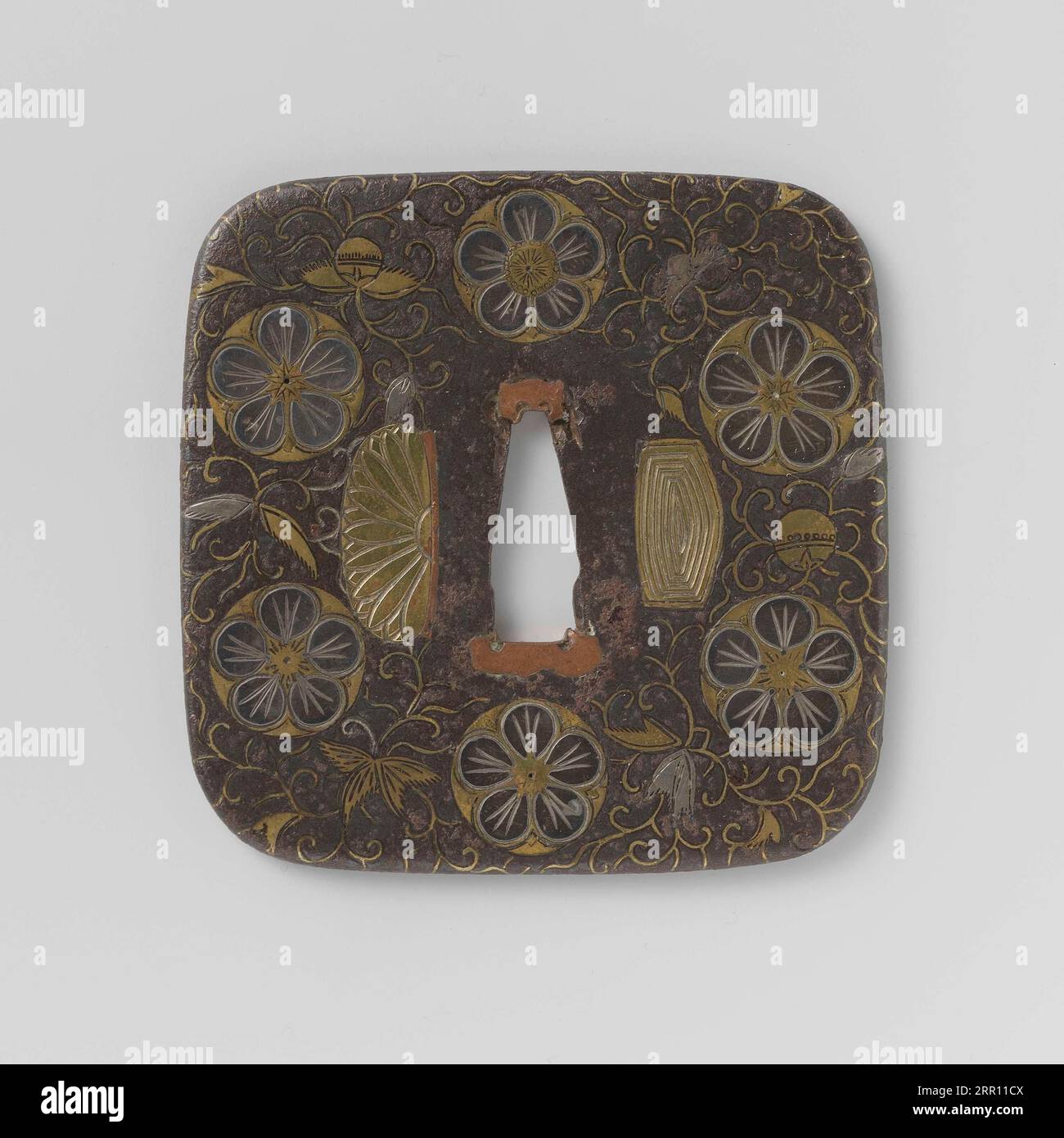 A round oval Iron Tsuba, a sword guard and part of a sword mounting. It ...