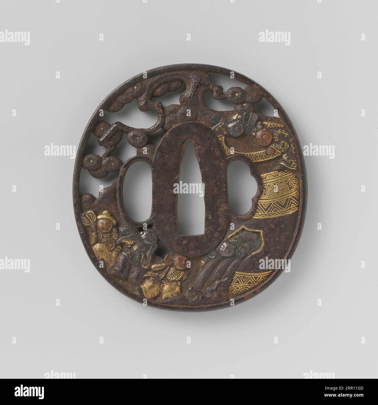 A round oval Iron Tsuba, a sword guard and part of a sword mounting. It ...