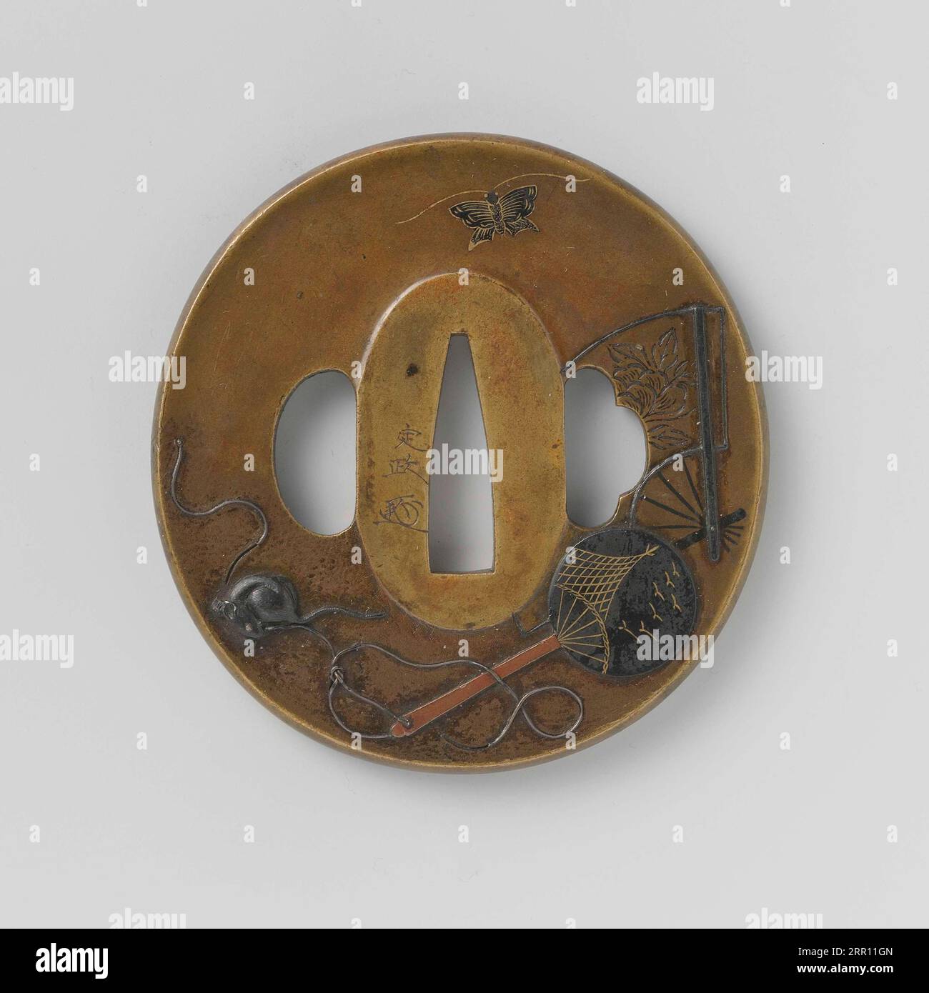 A round oval Iron Tsuba, a sword guard and part of a sword mounting. It ...