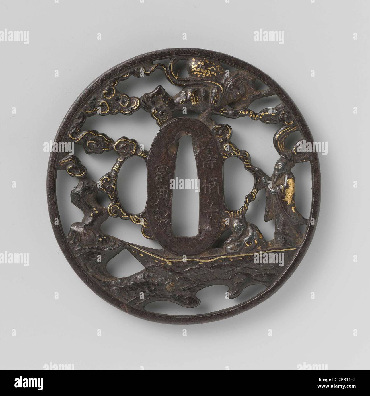 A round oval Iron Tsuba, a sword guard and part of a sword mounting. It ...