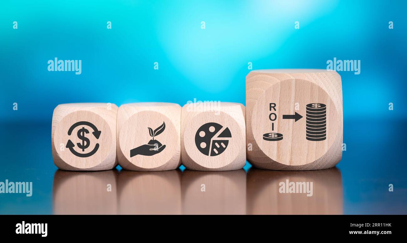 Wooden blocks with symbol of roi concept on blue background Stock Photo ...