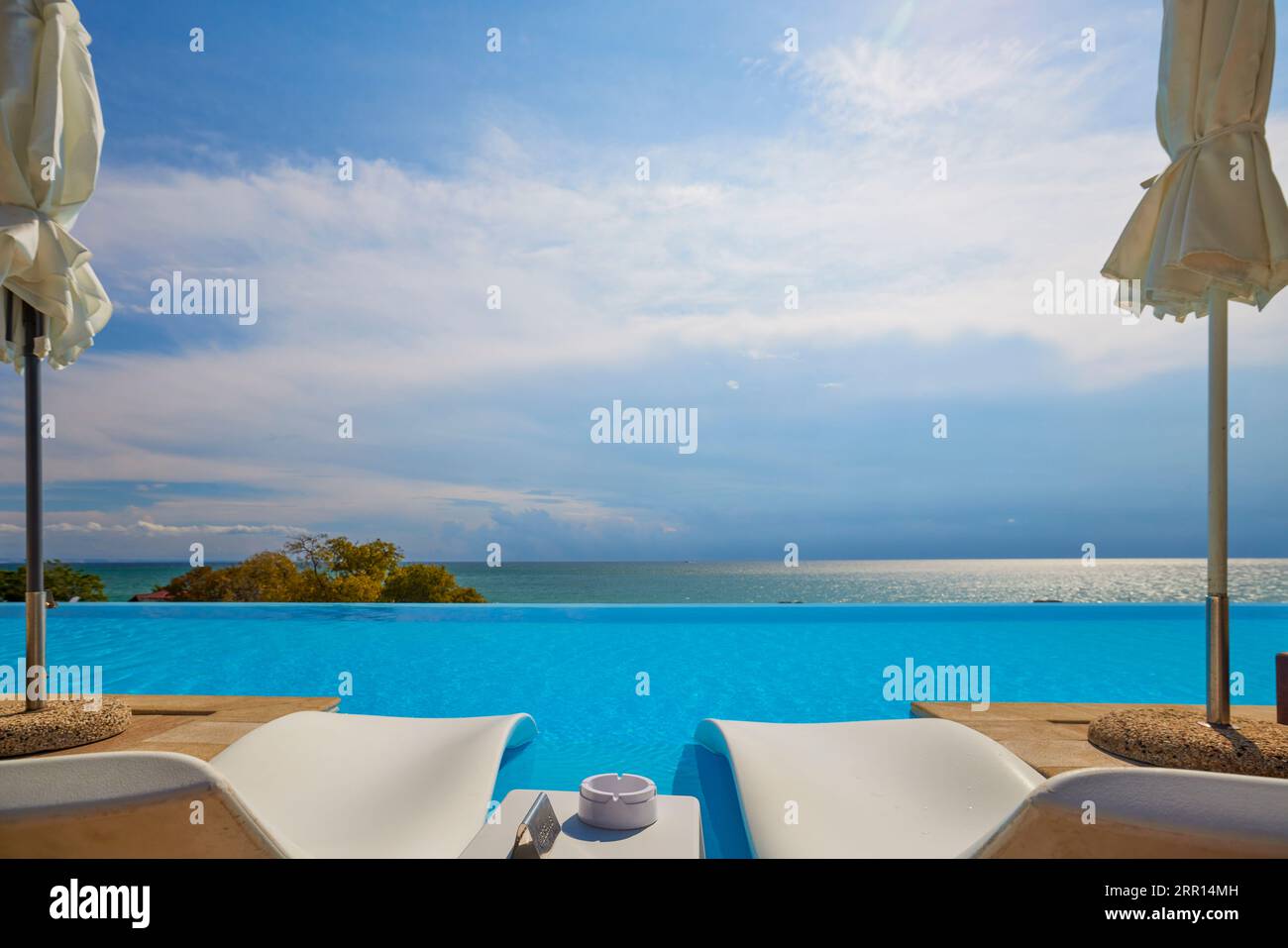 Beautiful landscape with an infinity pool by the sea Stock Photo - Alamy