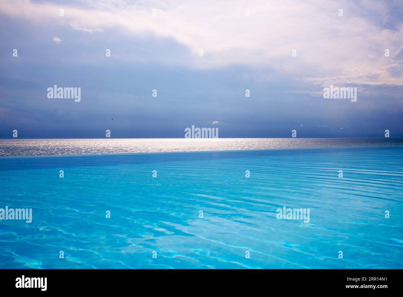 Beautiful landscape with an infinity pool by the sea Stock Photo - Alamy