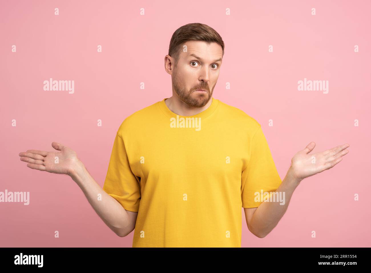Puzzled confused stunned man gesturing hands sign do not know isolated ...