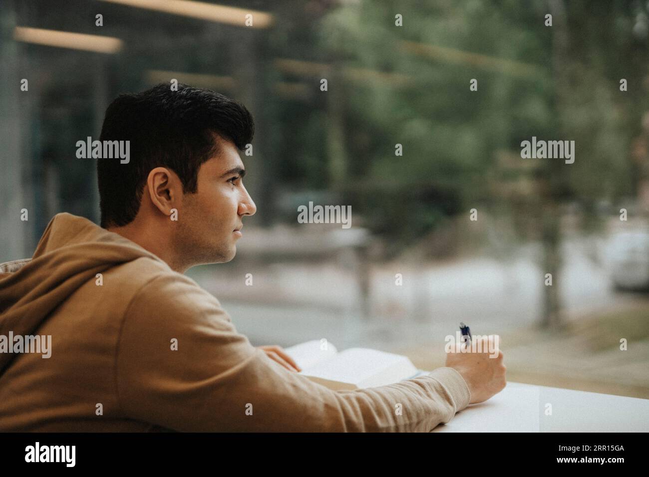 Male college student studying hi-res stock photography and images - Alamy