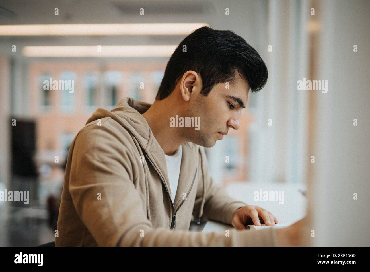 Male college student studying hi-res stock photography and images - Alamy