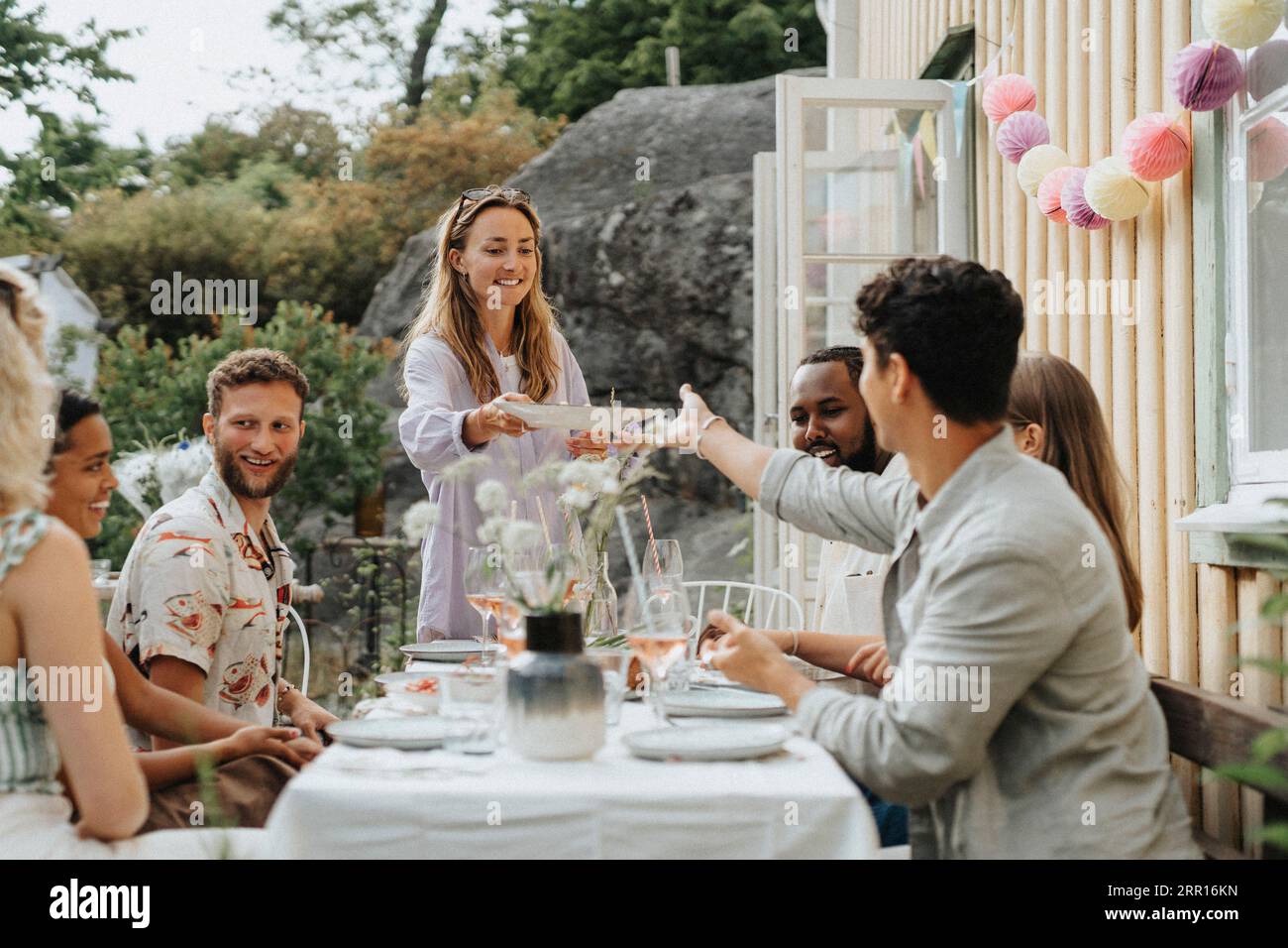 Woman sitting at outside tables hi-res stock photography and images - Alamy