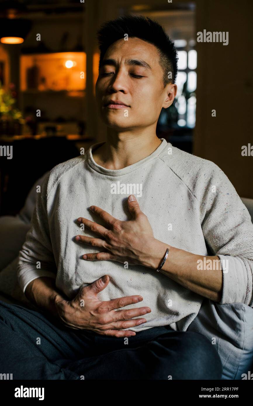 Hands to chest hi-res stock photography and images - Alamy