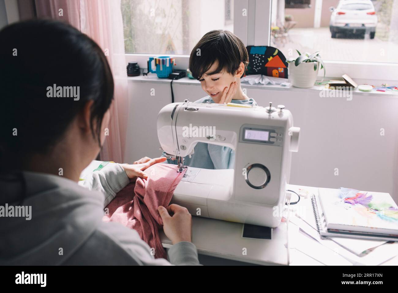 Family life sewing hi-res stock photography and images - Alamy