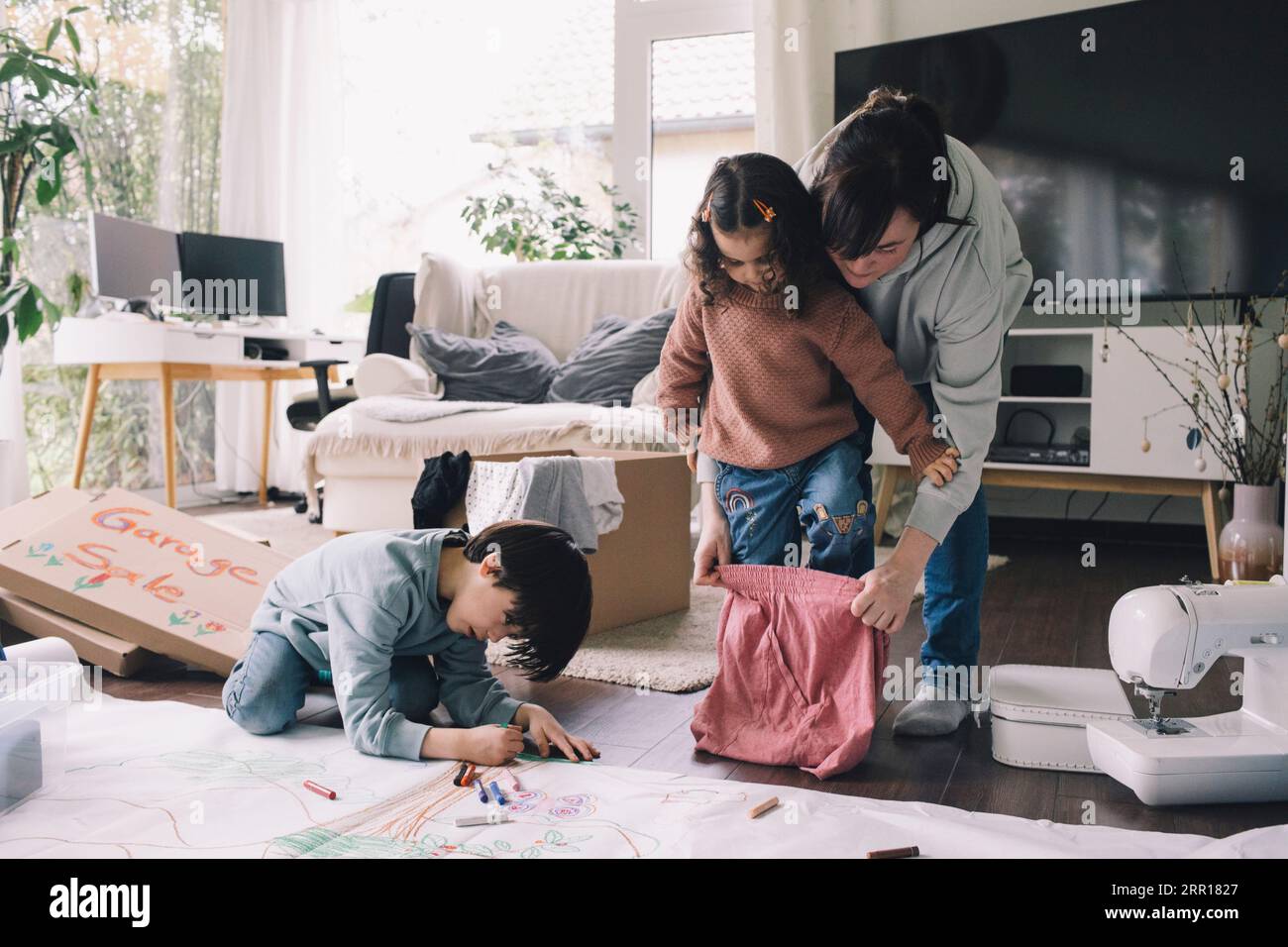 Young adult helping children germany hi-res stock photography and ...