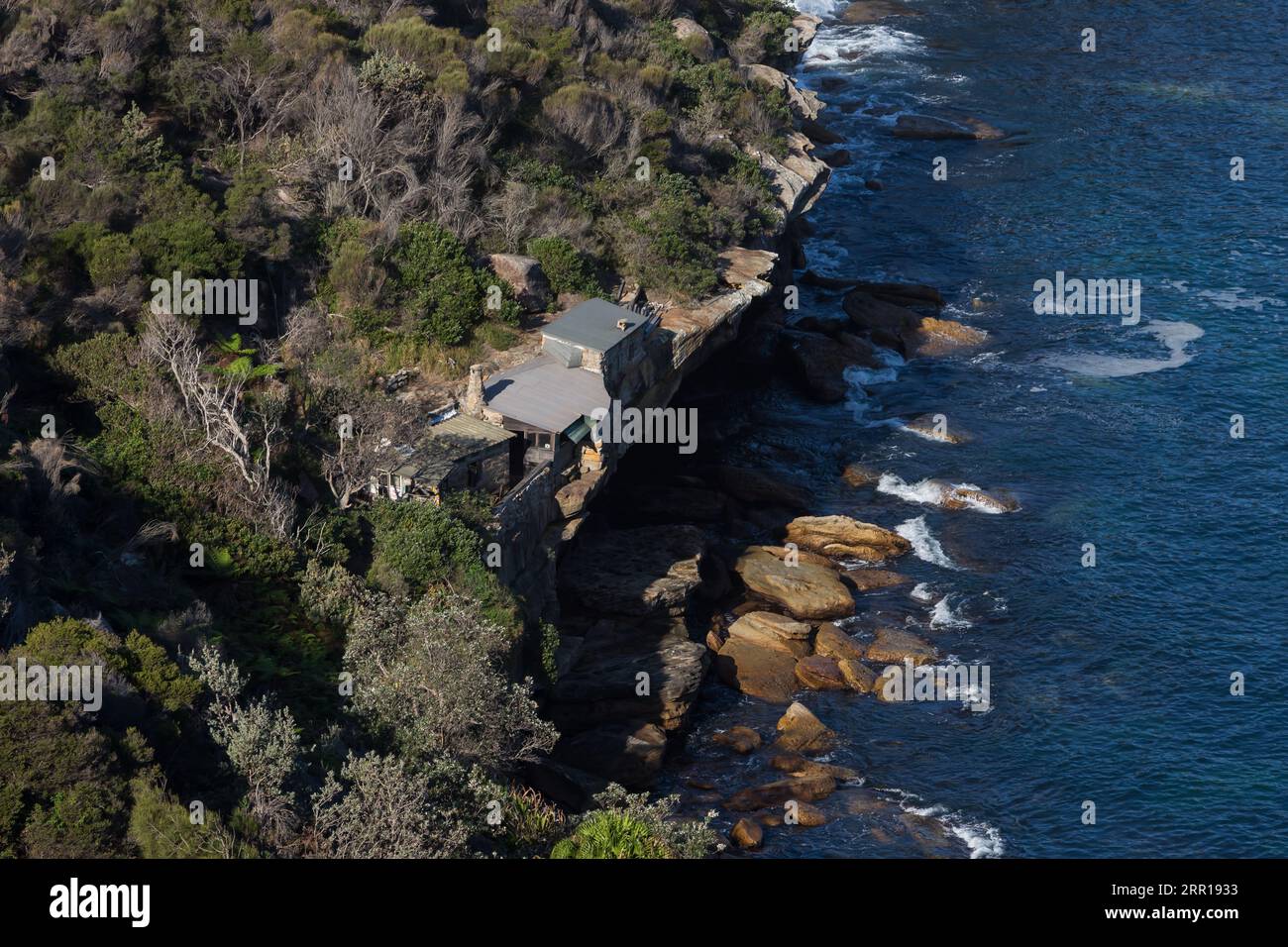 A remote house on the edge of the cliffs viewed from Georges Head ...