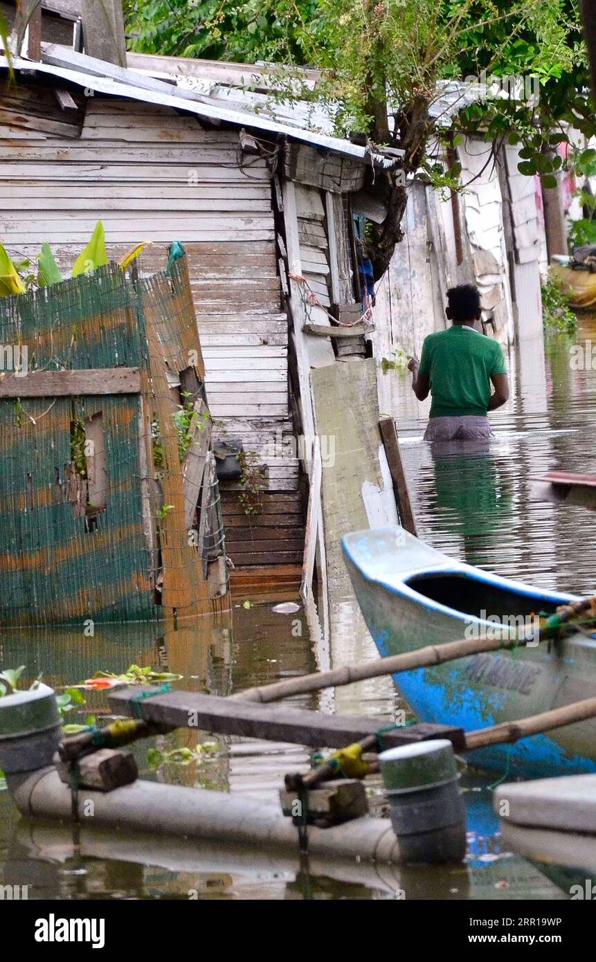 200910 -- COLOMBO, Sept. 10, 2020 -- A man wades through floodwater due ...