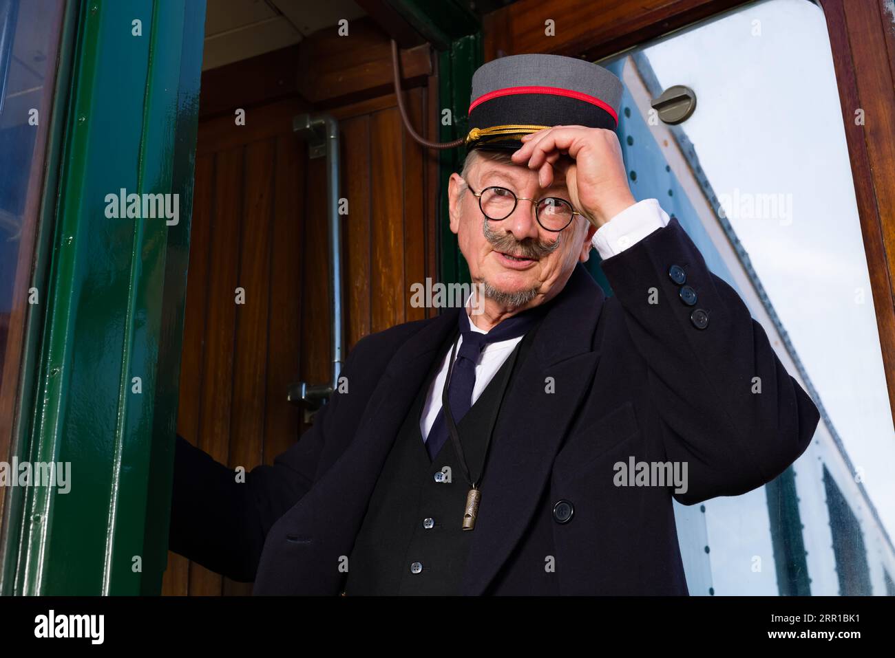 Reenactment scene with authentic 1927 1st class train carriage and a ...