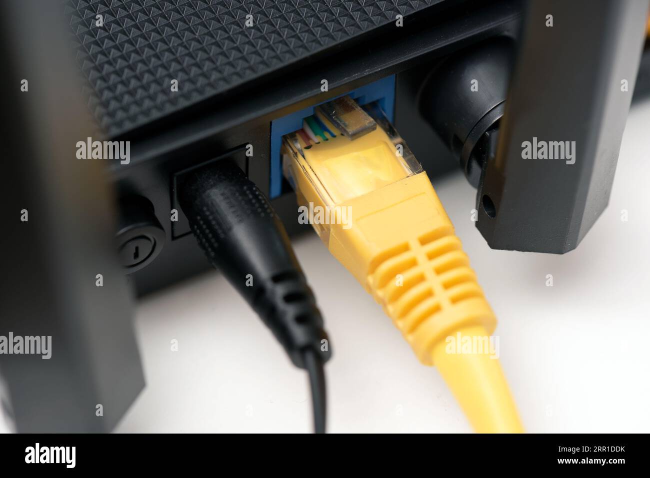 Network cables connected to a router or modem Stock Photo - Alamy