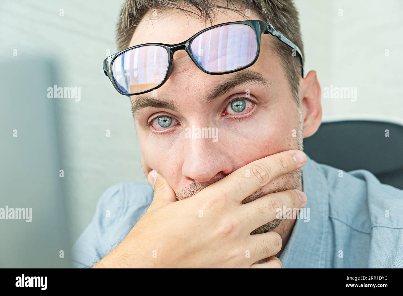 Tired man take glasses of working too long at computer, exhausted ...