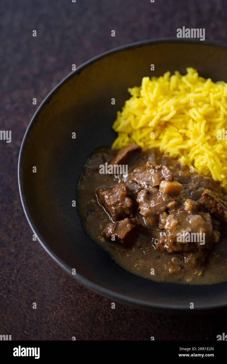 Goan beef curry and turmeric basmati rice Stock Photo - Alamy