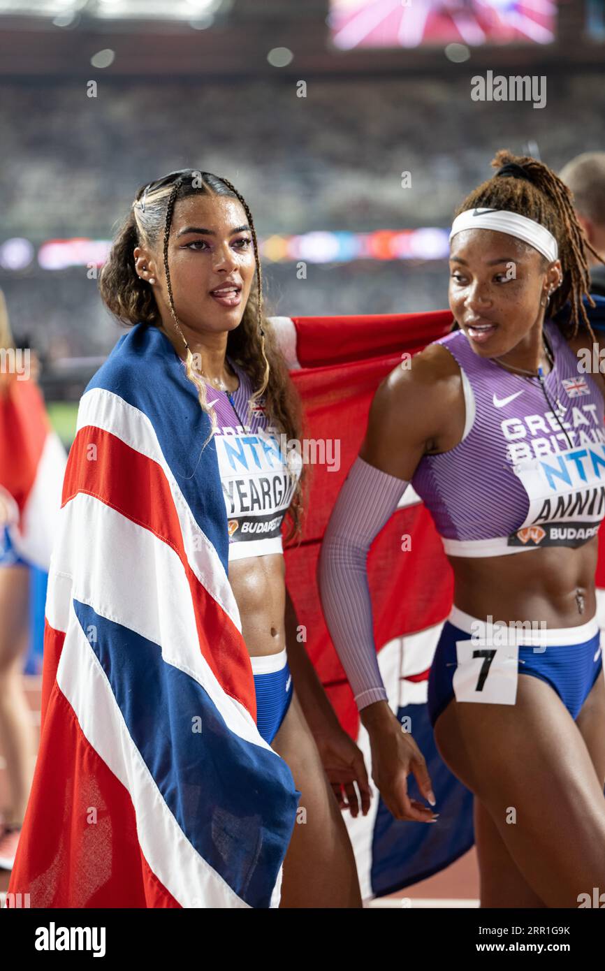 Amber Anning and Nicole Yeargin with her country's flag in the 4x400 ...