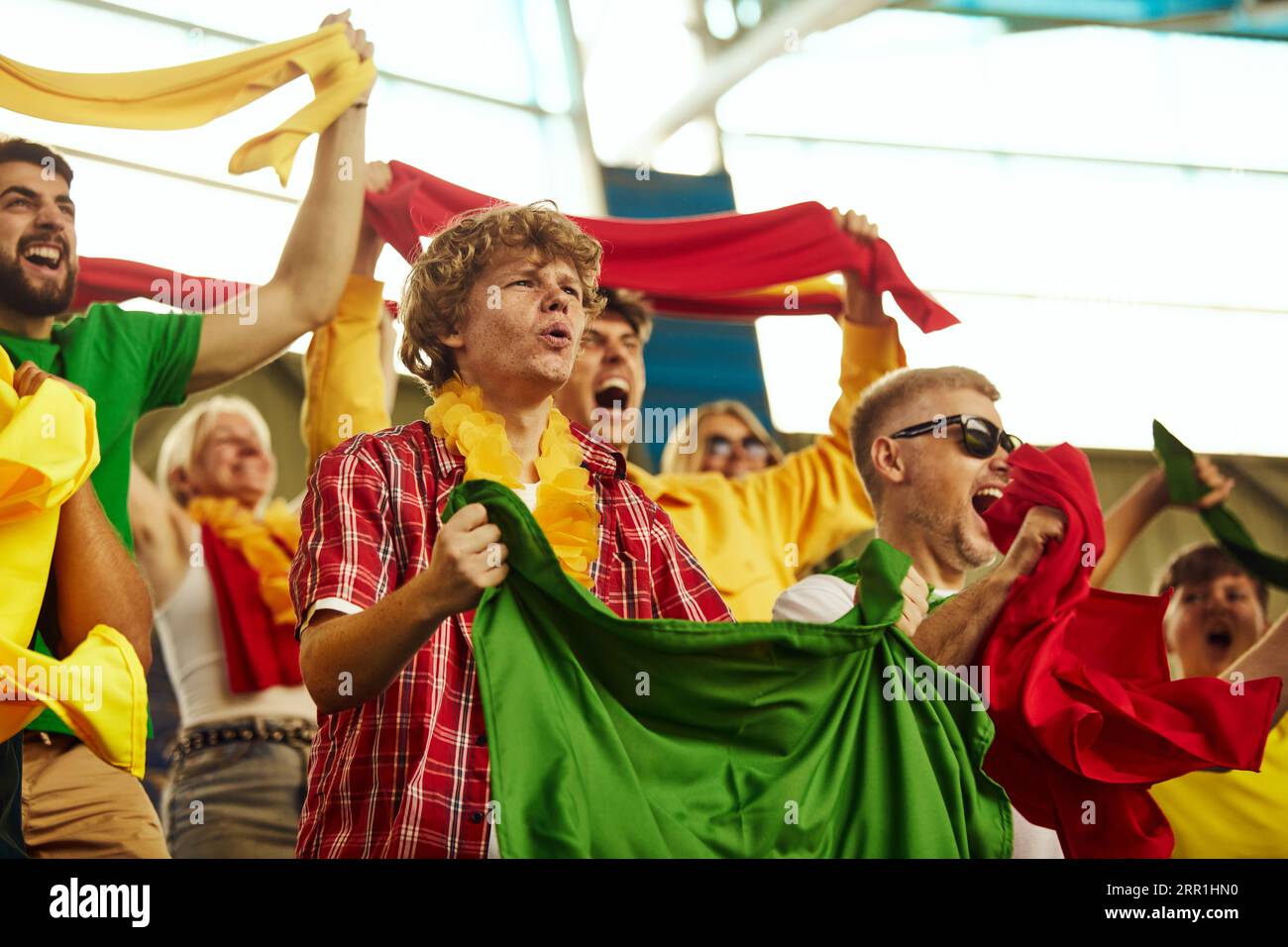 Emotional people, loud sport fans on tadium, attending soccer match and ...