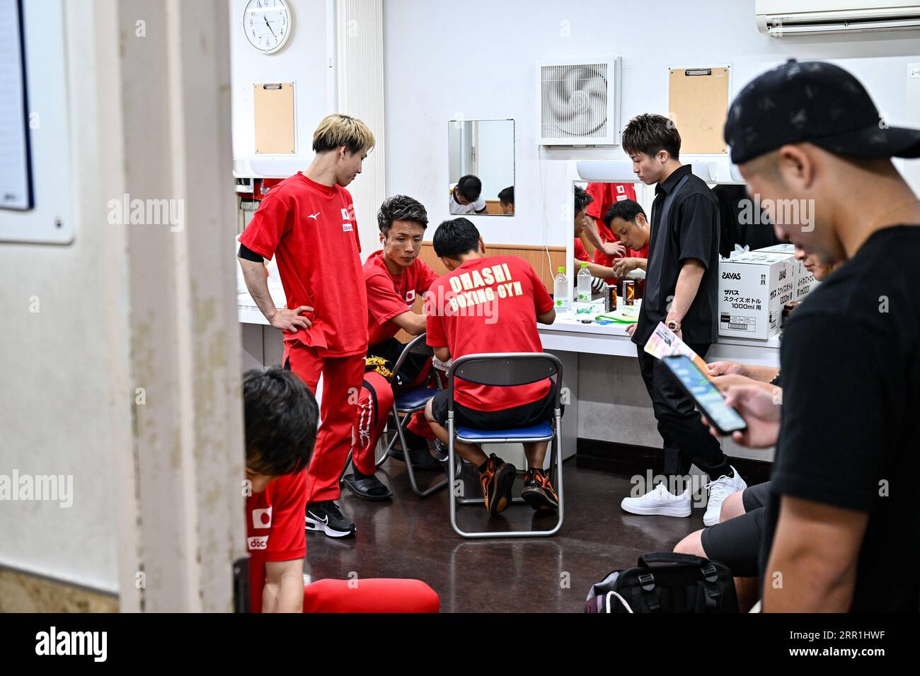 Tokyo, Japan. 30th Aug, 2023. Seiya Yamaguchi, second left, has his hands wrapped in bandages by ...