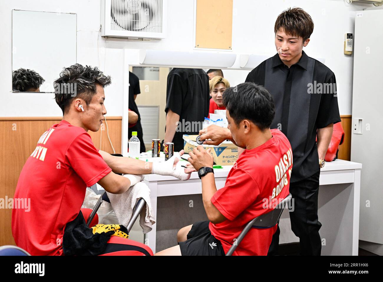 Tokyo, Japan. 30th Aug, 2023. Seiya Yamaguchi, left, has his hands wrapped in bandages by ...