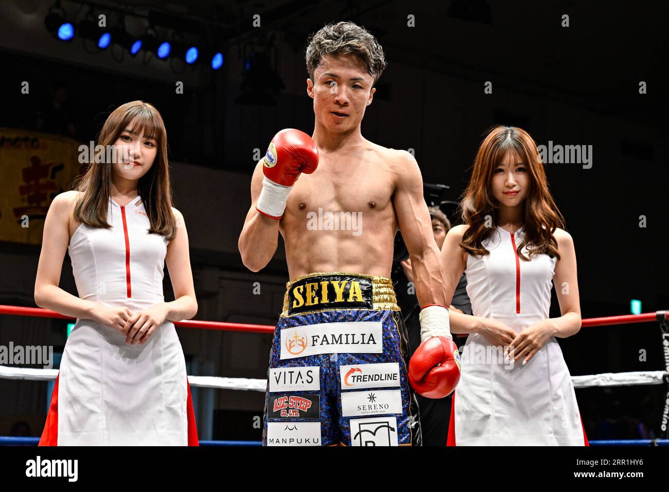 Tokyo, Japan. 30th Aug, 2023. Seiya Yamaguchi, center, poses with ring girls Yuna Nakamata, left ...