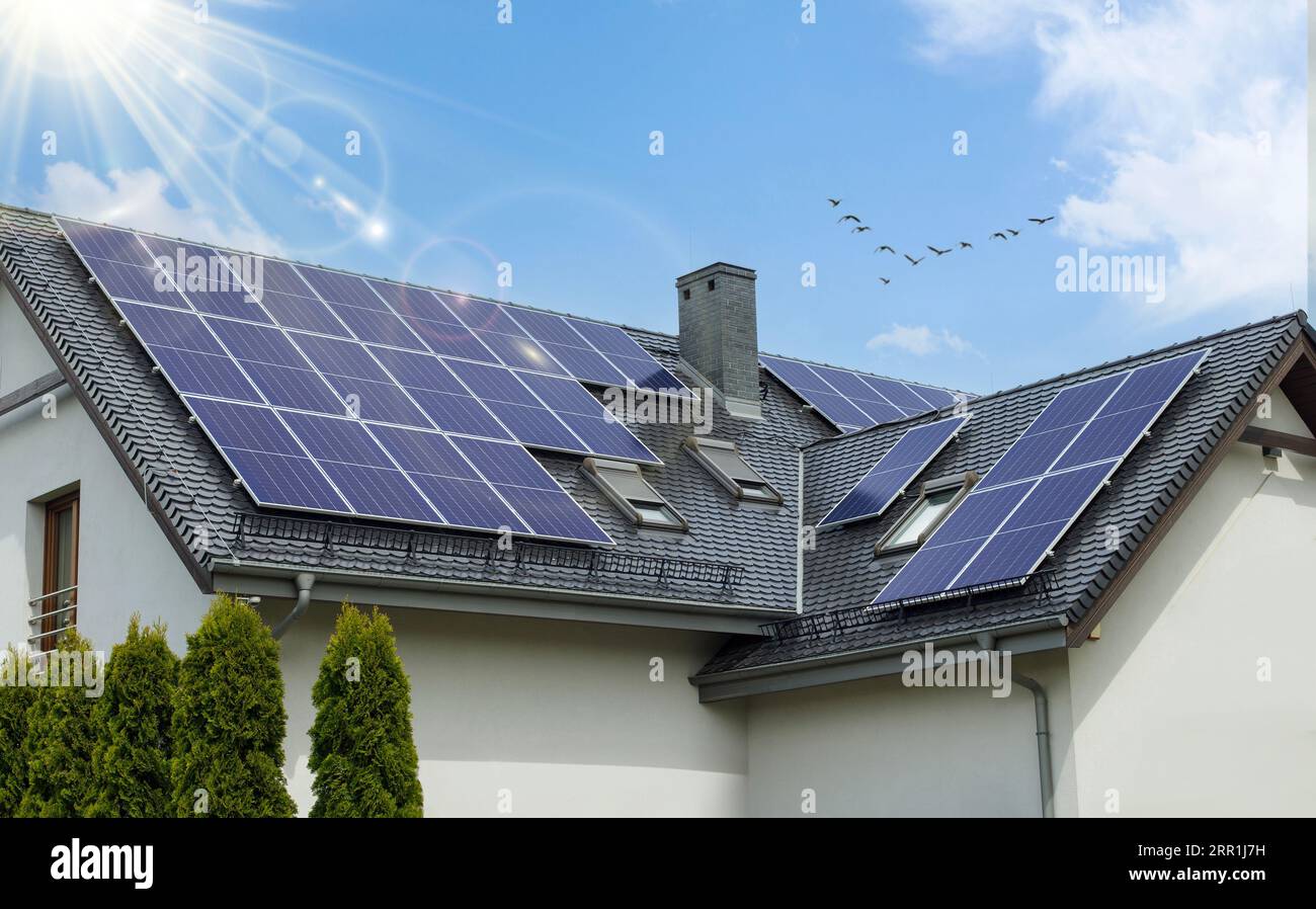 Eco-Friendly House with Solar Panels on Gable Roof Stock Photo - Alamy