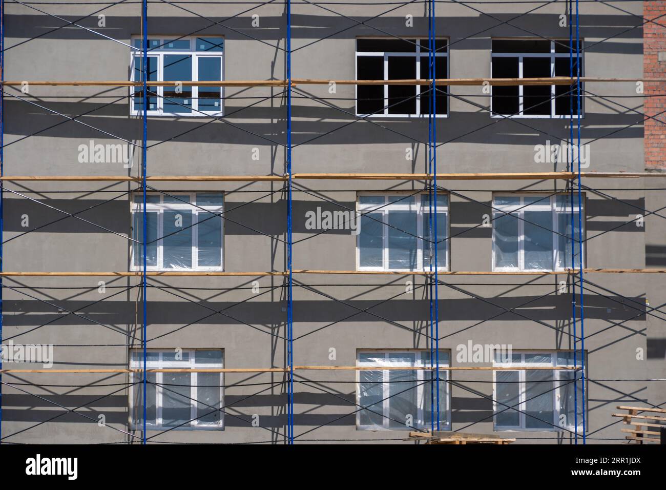 Facade restoration work. Scaffolding in front of the facade. Building ...