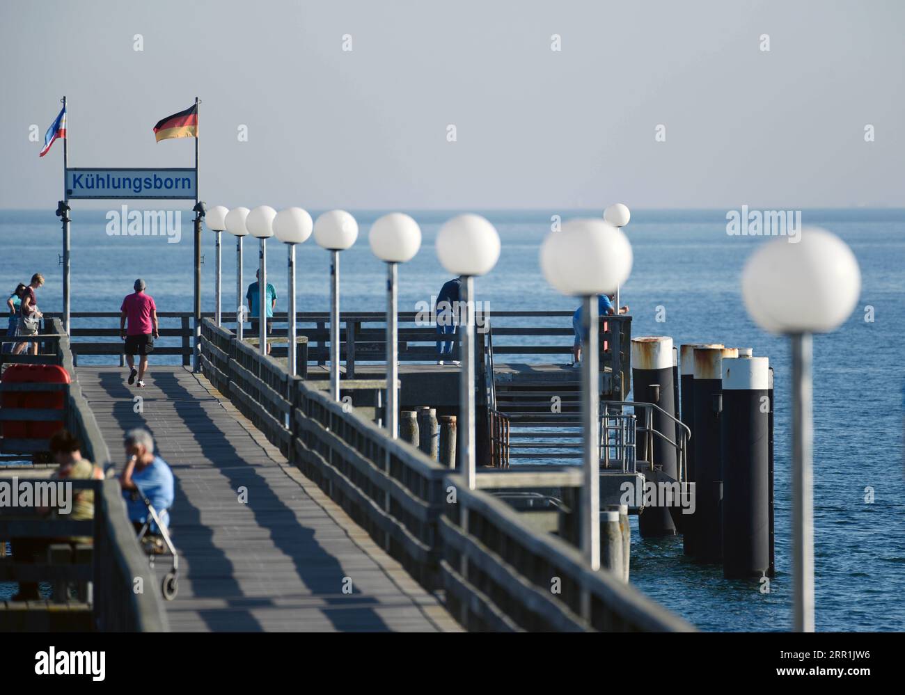 06 September 2023, Hamburg, Kühlungsborn: Strollers on the pier of the ...
