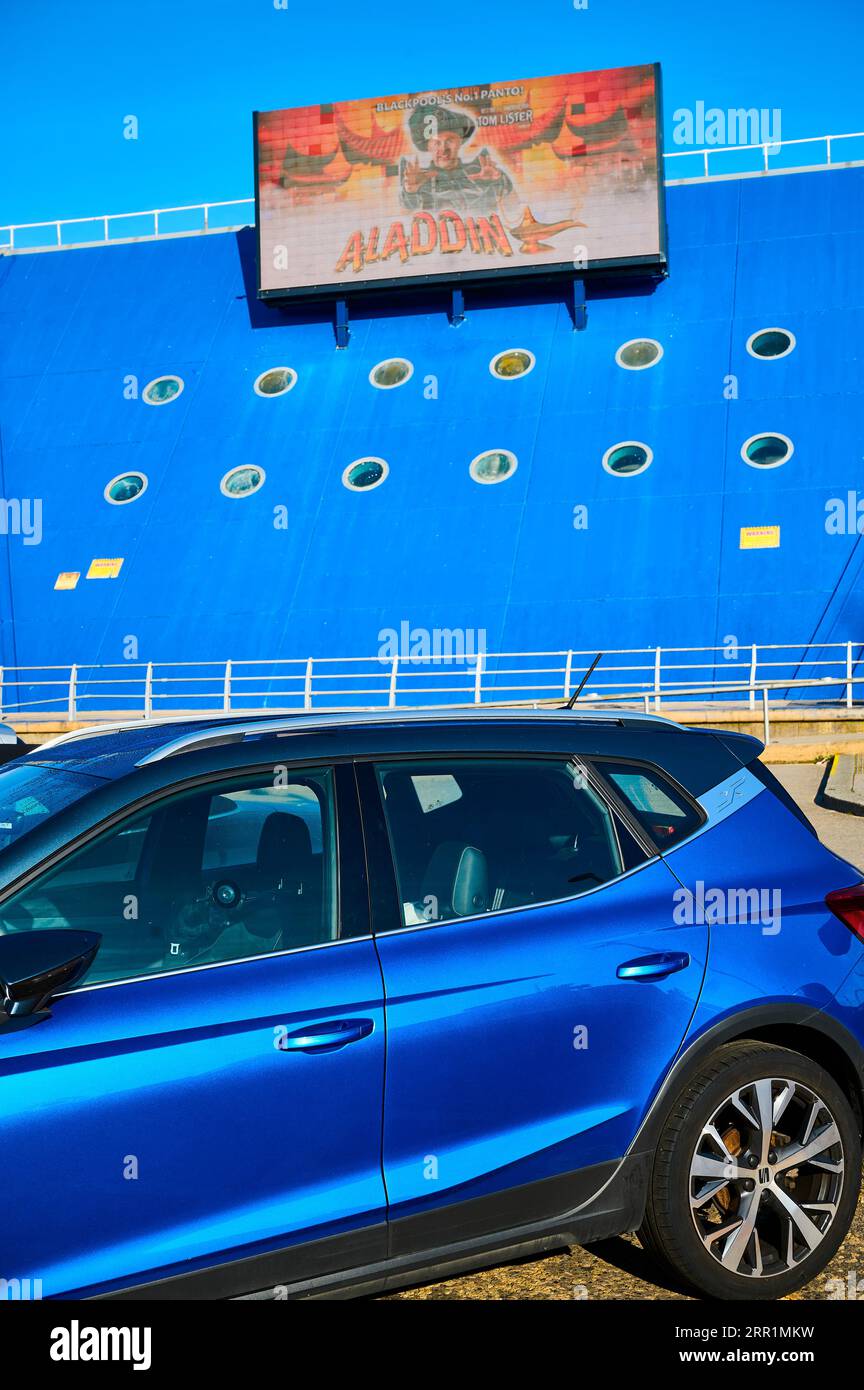 Blue saloon car against tlue wall of the Sandcastle Water Park ...