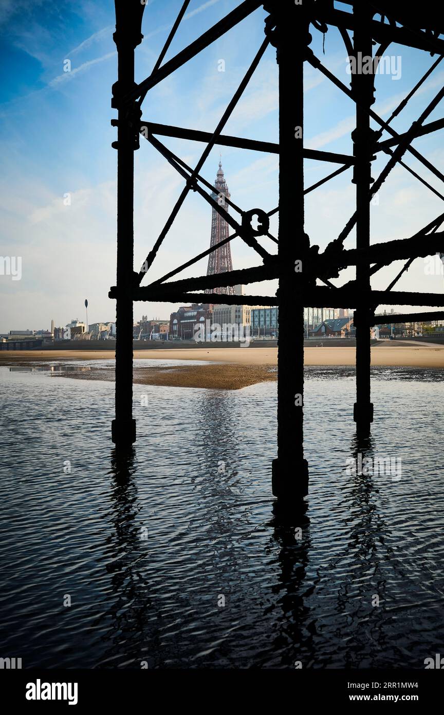 Blackpool Tower seen through the silhouetted legs of Central Pier Stock ...