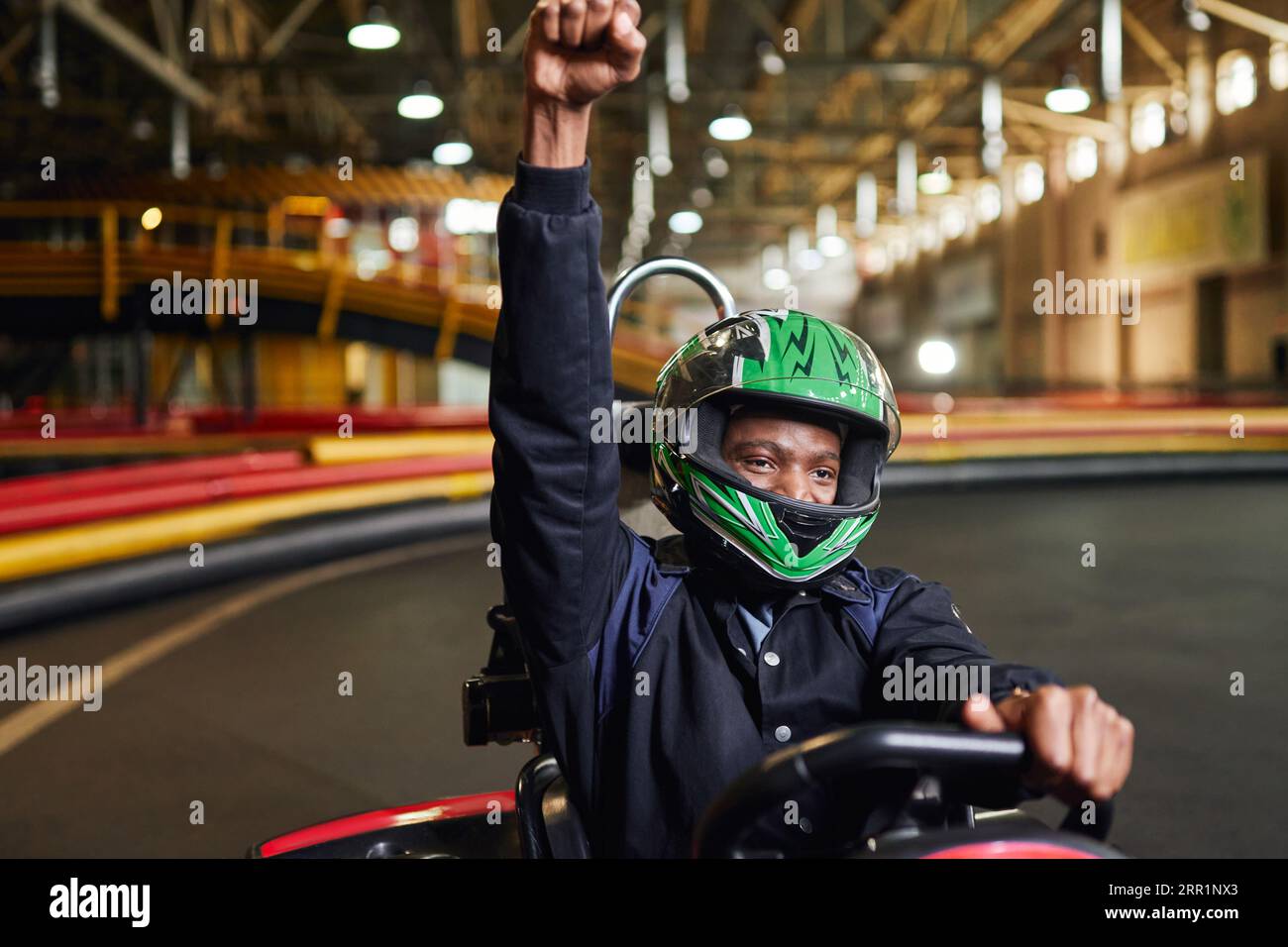Go kart speed drive indoor race, excited african american driver in ...