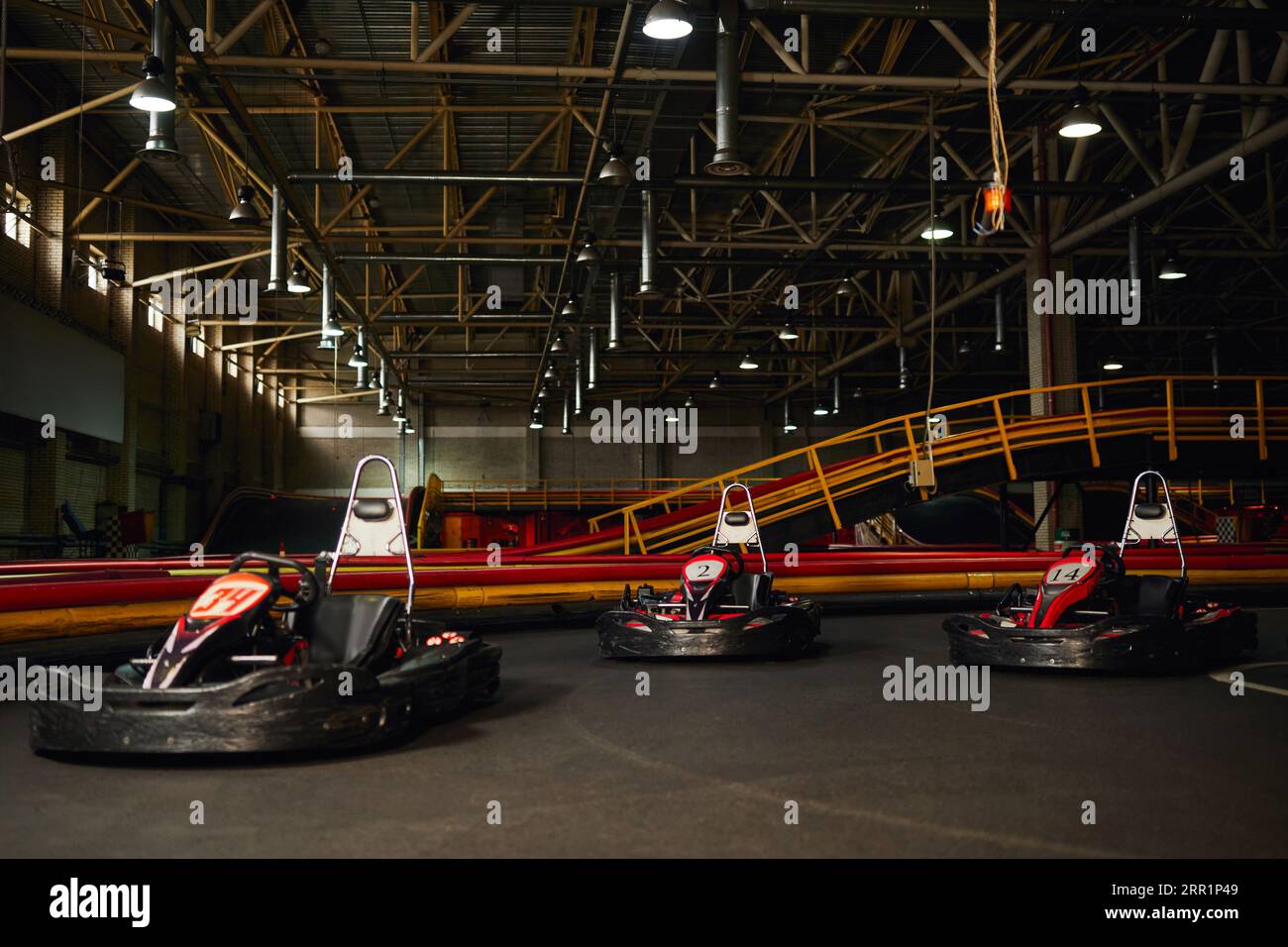 modern racing cars inside of indoor kart circuit, motor race sport ...