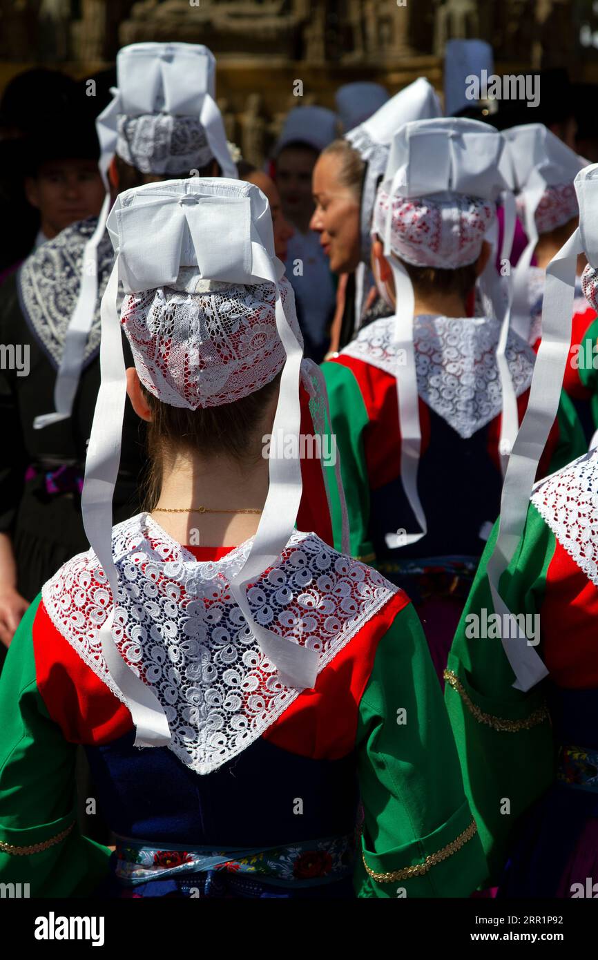 Breton dancers in traditional costume and headdress..Fete des fraises ...