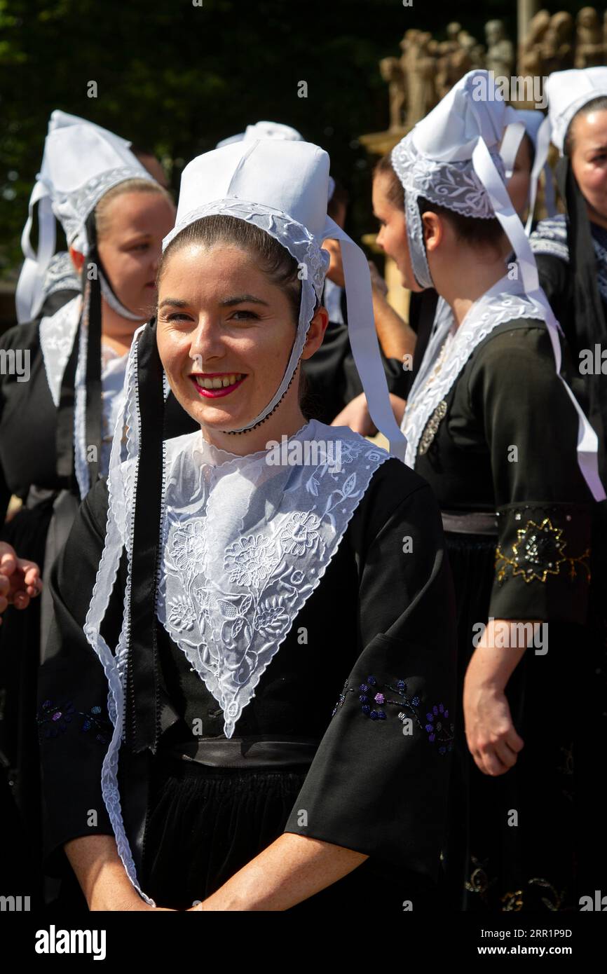Breton dancers in traditional costume and headdress..Fete des fraises ...