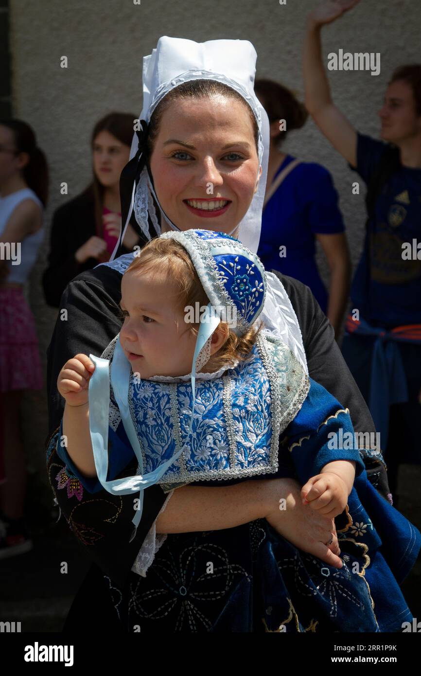 Breton dancers in traditional costume and headdress..Fete des fraises ...