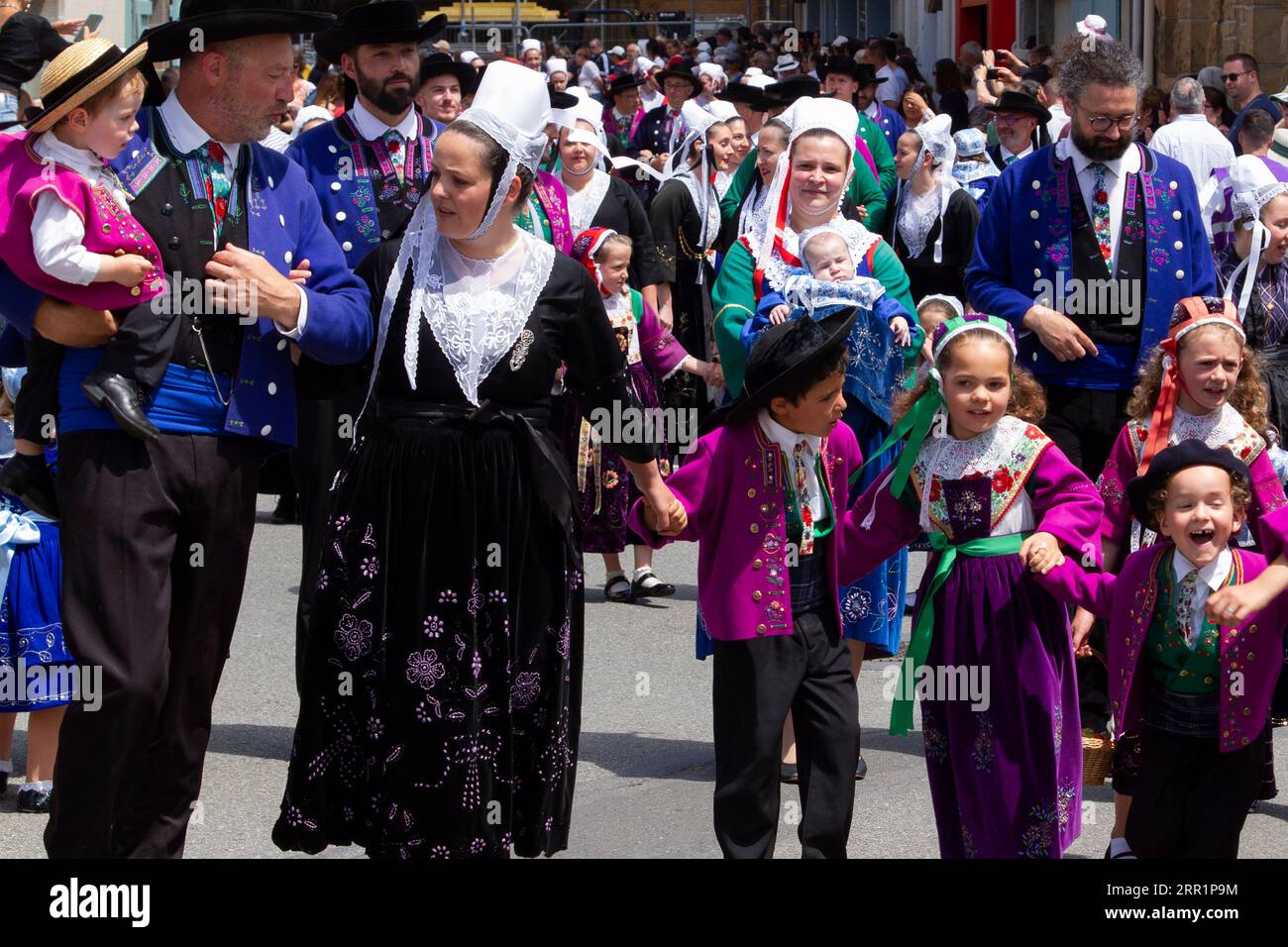 Breton dancers in traditional costume and headdress..Fete des fraises ...