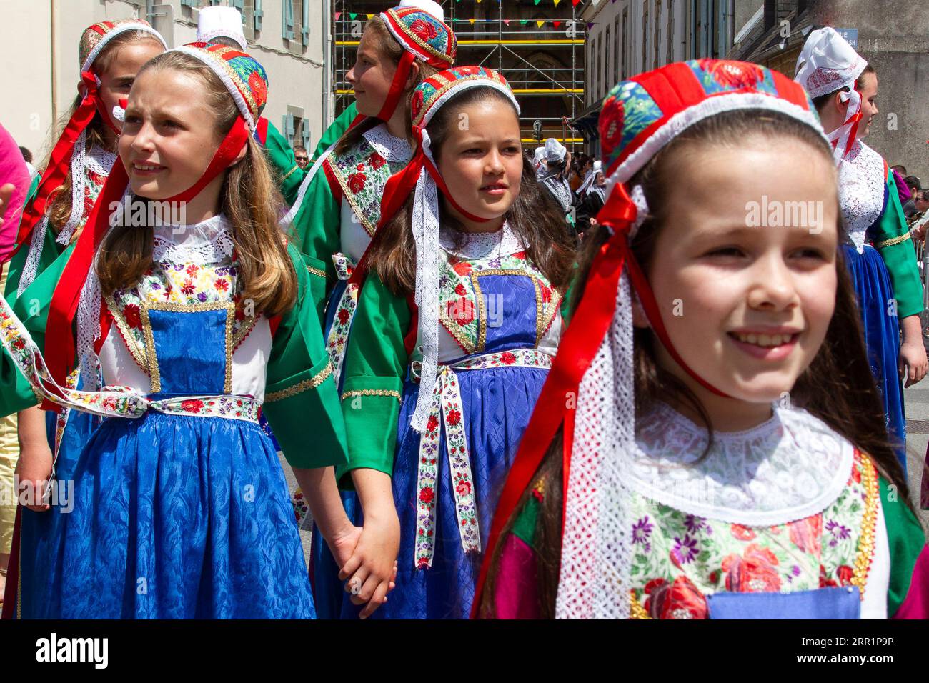 Breton dancers in traditional costume and headdress..Fete des fraises ...