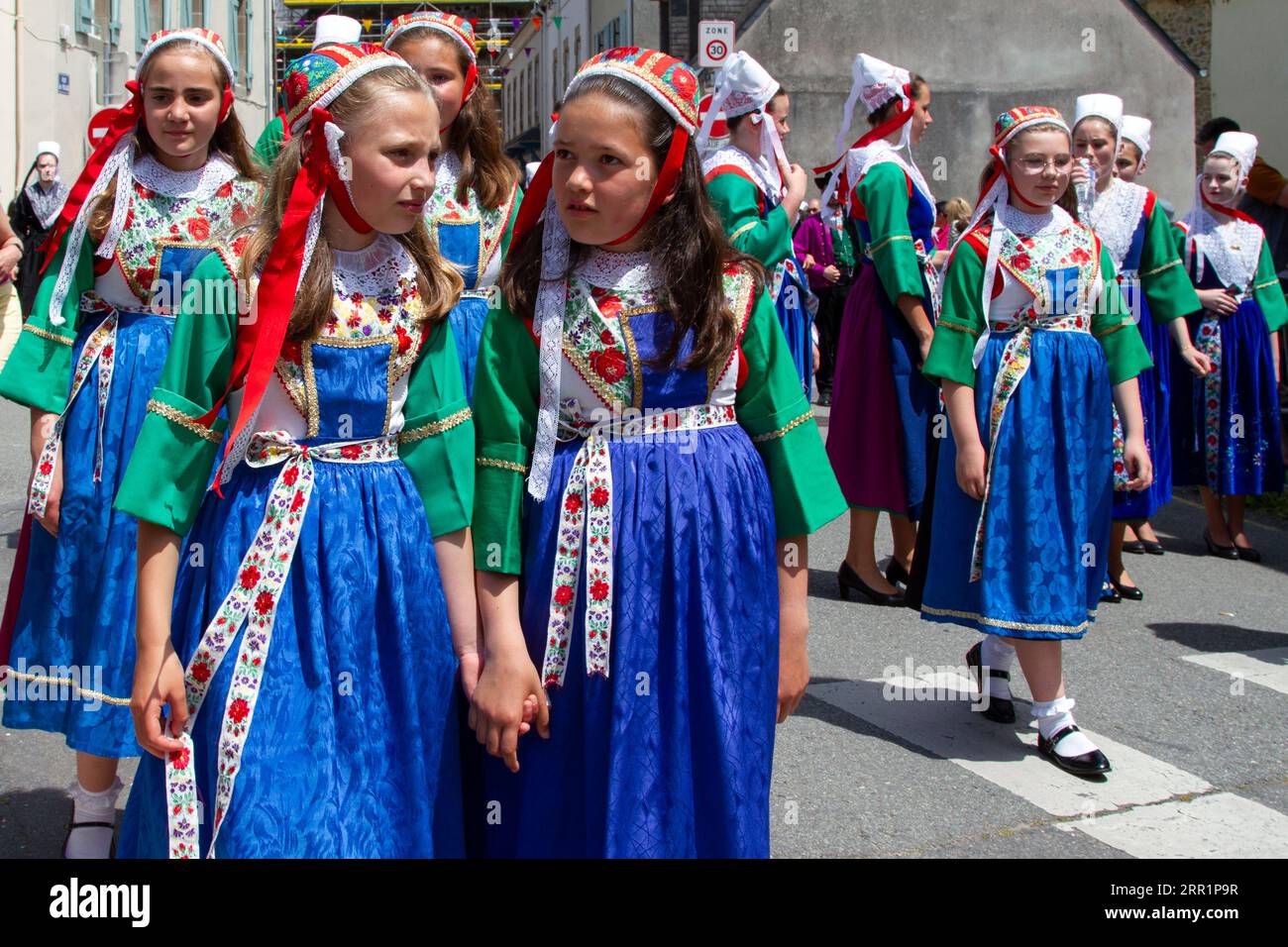 Breton dancers in traditional costume and headdress..Fete des fraises ...