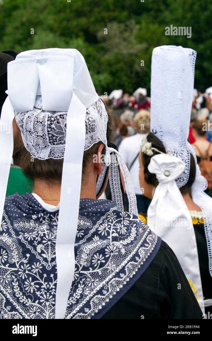 Breton dancers in traditional costume and headdress..Fete des fraises ...