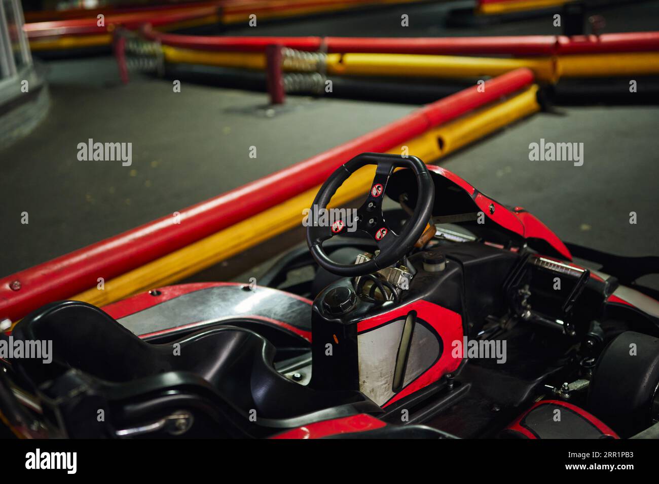 design of red racing car inside of indoor kart circuit, motor race ...