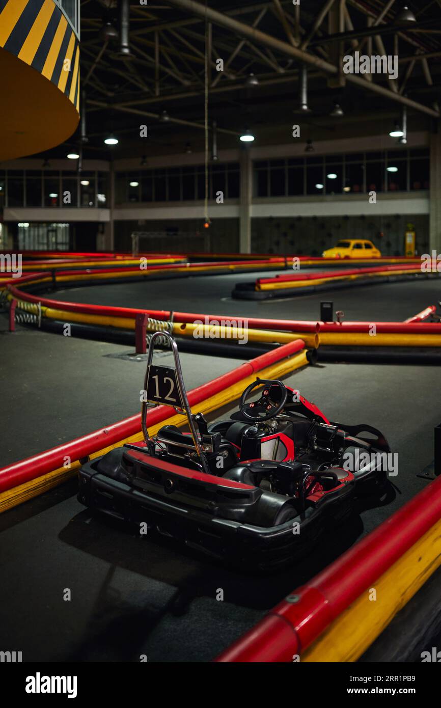 design of racing car inside of indoor kart circuit, red motor race ...