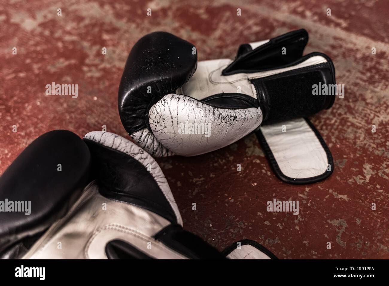 Red boxing gloves on floor hi-res stock photography and images - Alamy
