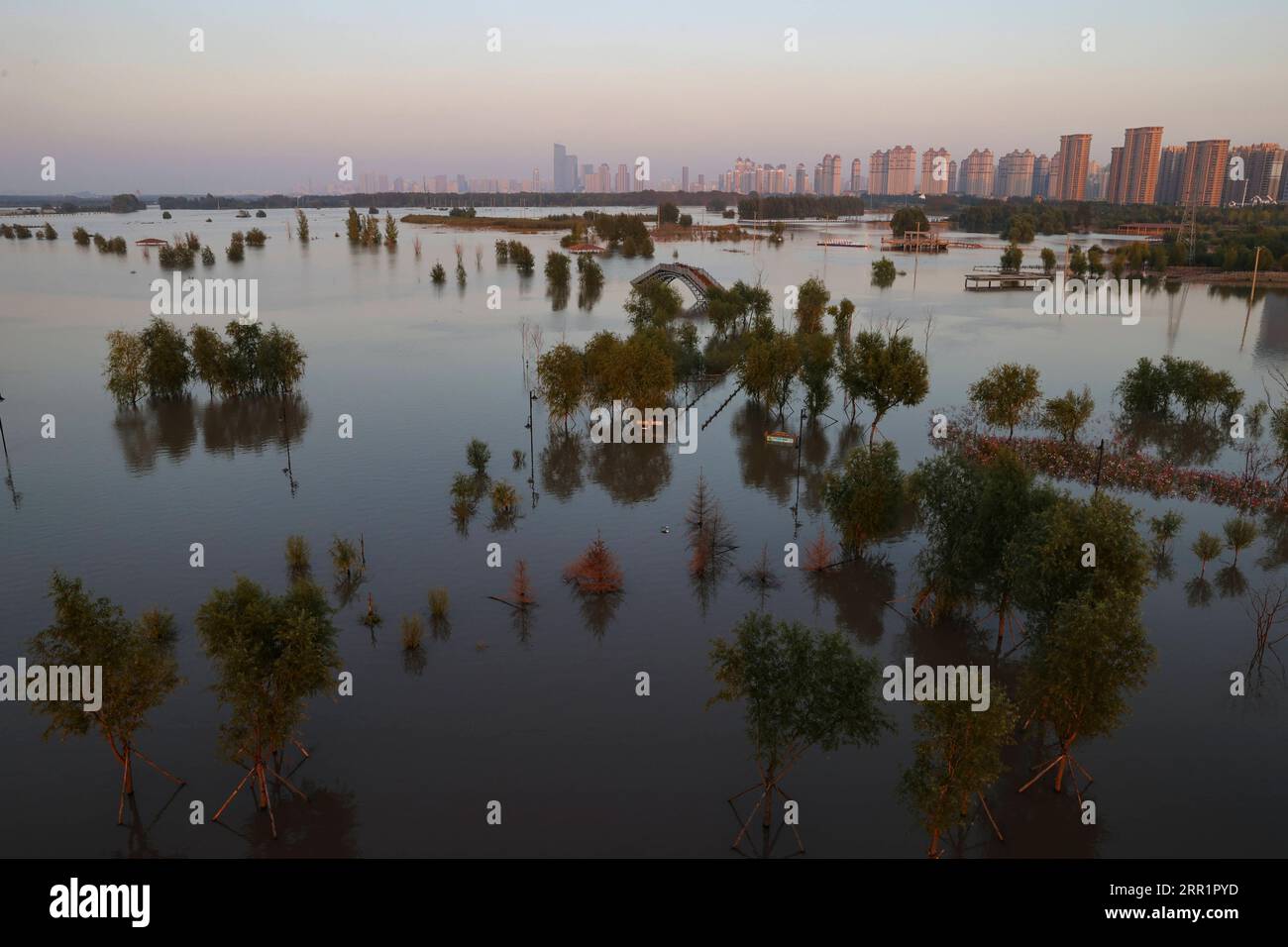 200923 -- HARBIN, Sept. 23, 2020 -- Park facilities are submerged at ...