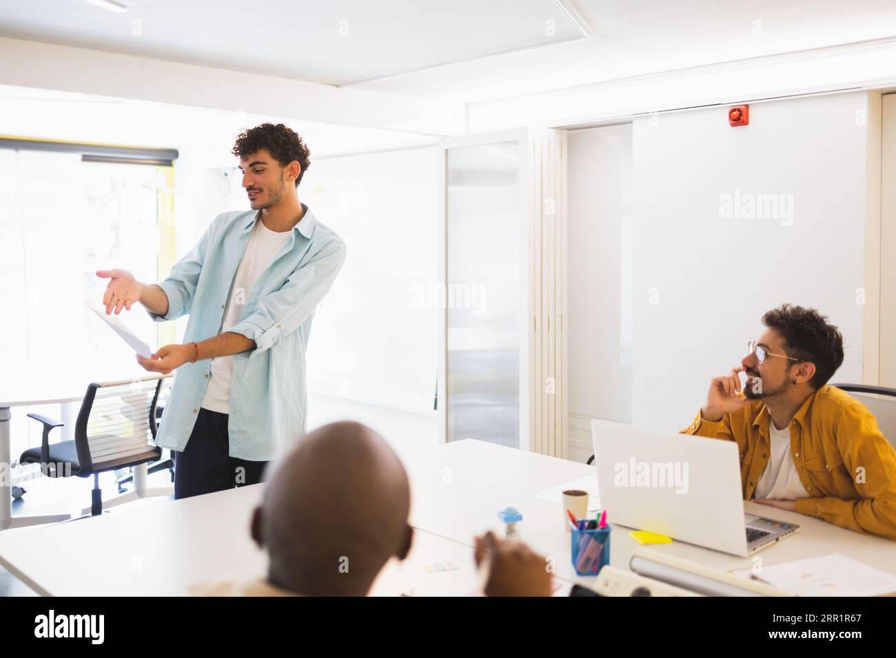 Group of multiracial employees gathering together while working at ...