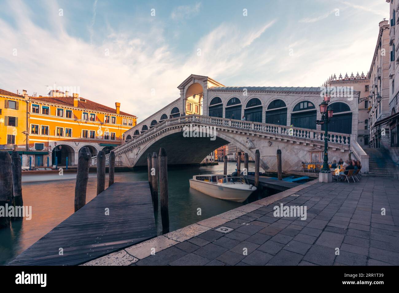 Low angle of old historic building with columns and arched passage with ...