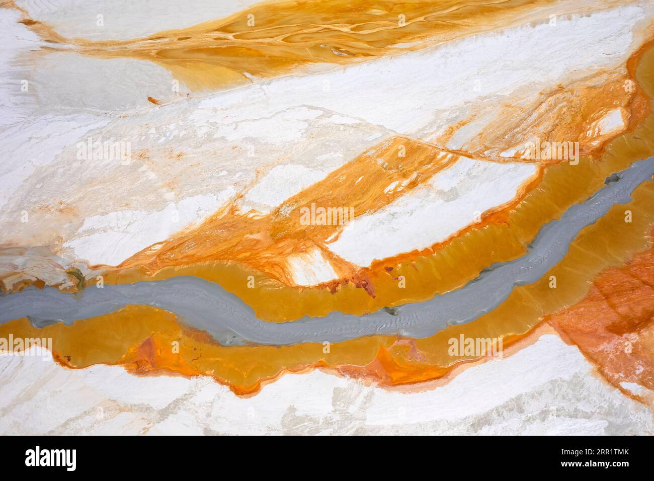 Abstract full frame background of yellow colored surface of mineral ...