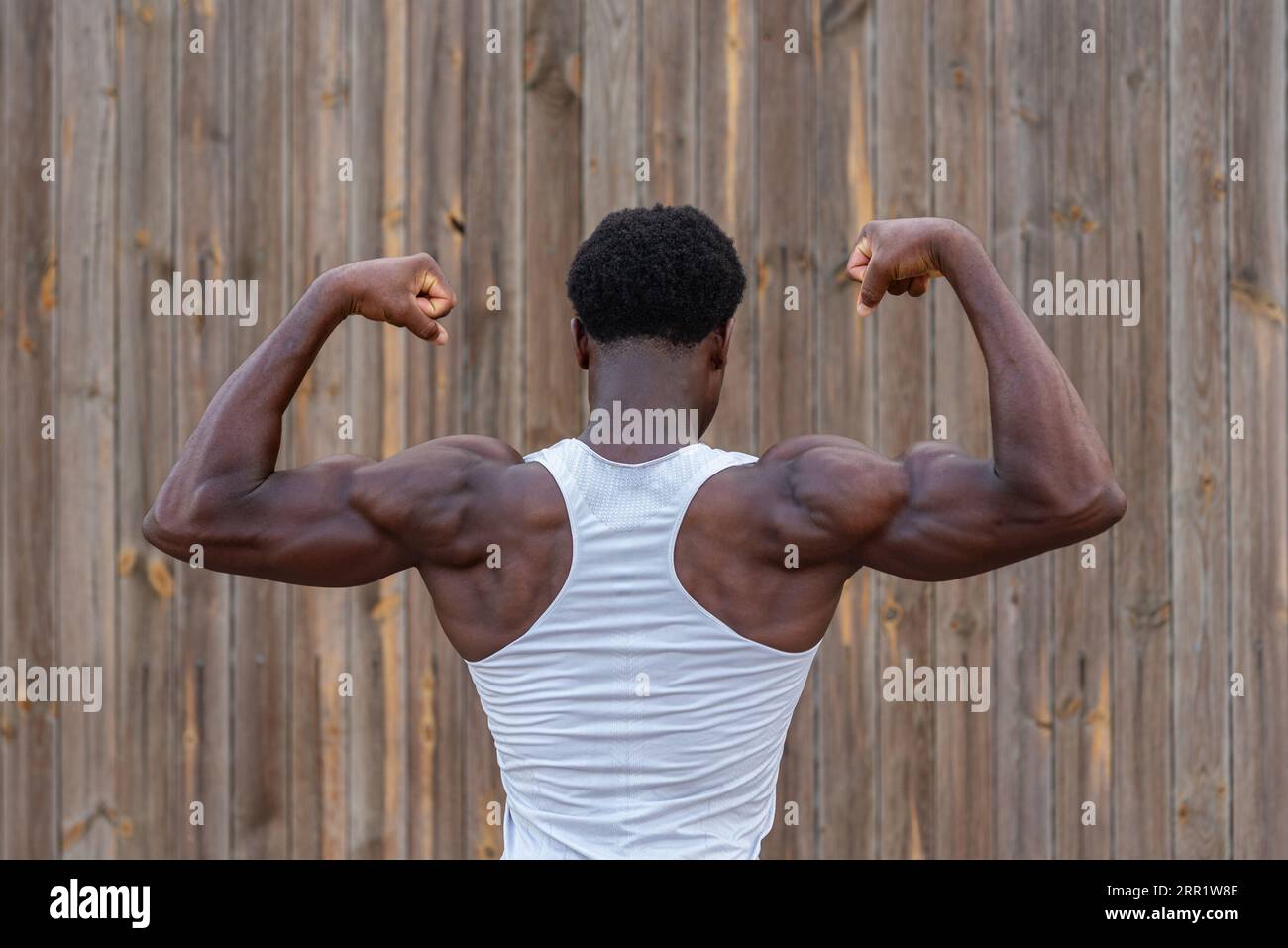 Back view of confident muscular African American male bodybuilder in ...